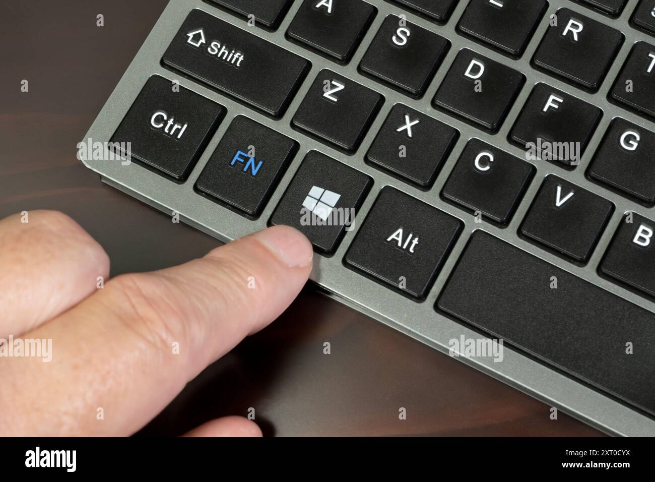 man pressing windows key on a laptop keyboard Stock Photo - Alamy
