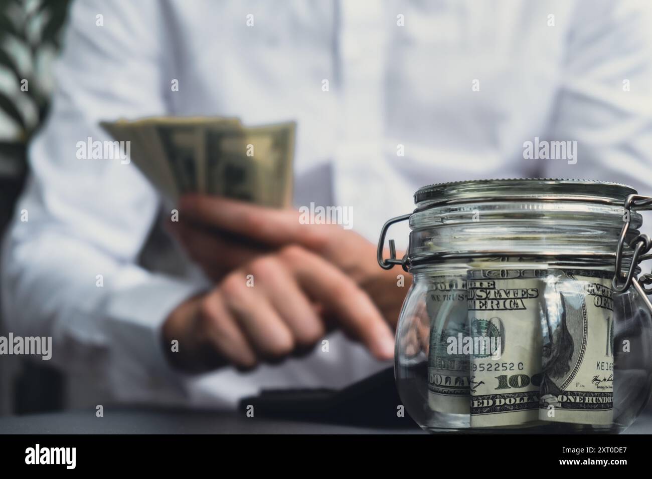 Hands collecting american dollar bills hi-res stock photography and ...