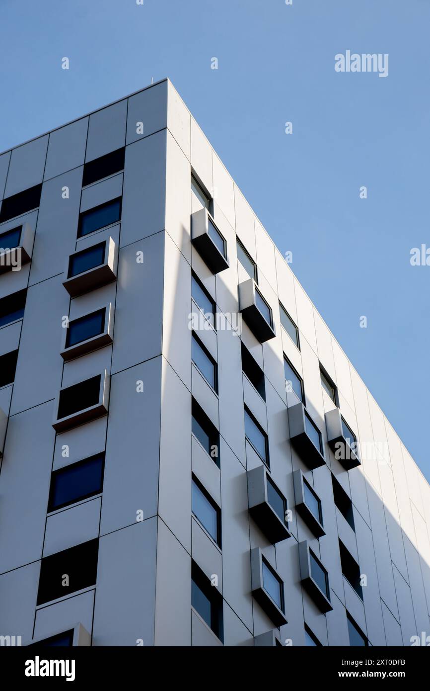 Modern white building with square windows. Multistory apartment ...