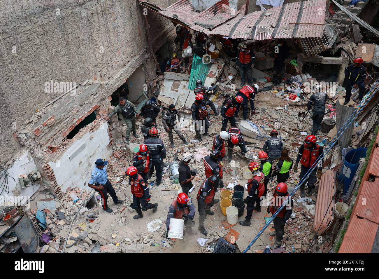 Caracas, Venezuela. 12th Aug, 2024. Security and rescue workers carry ...