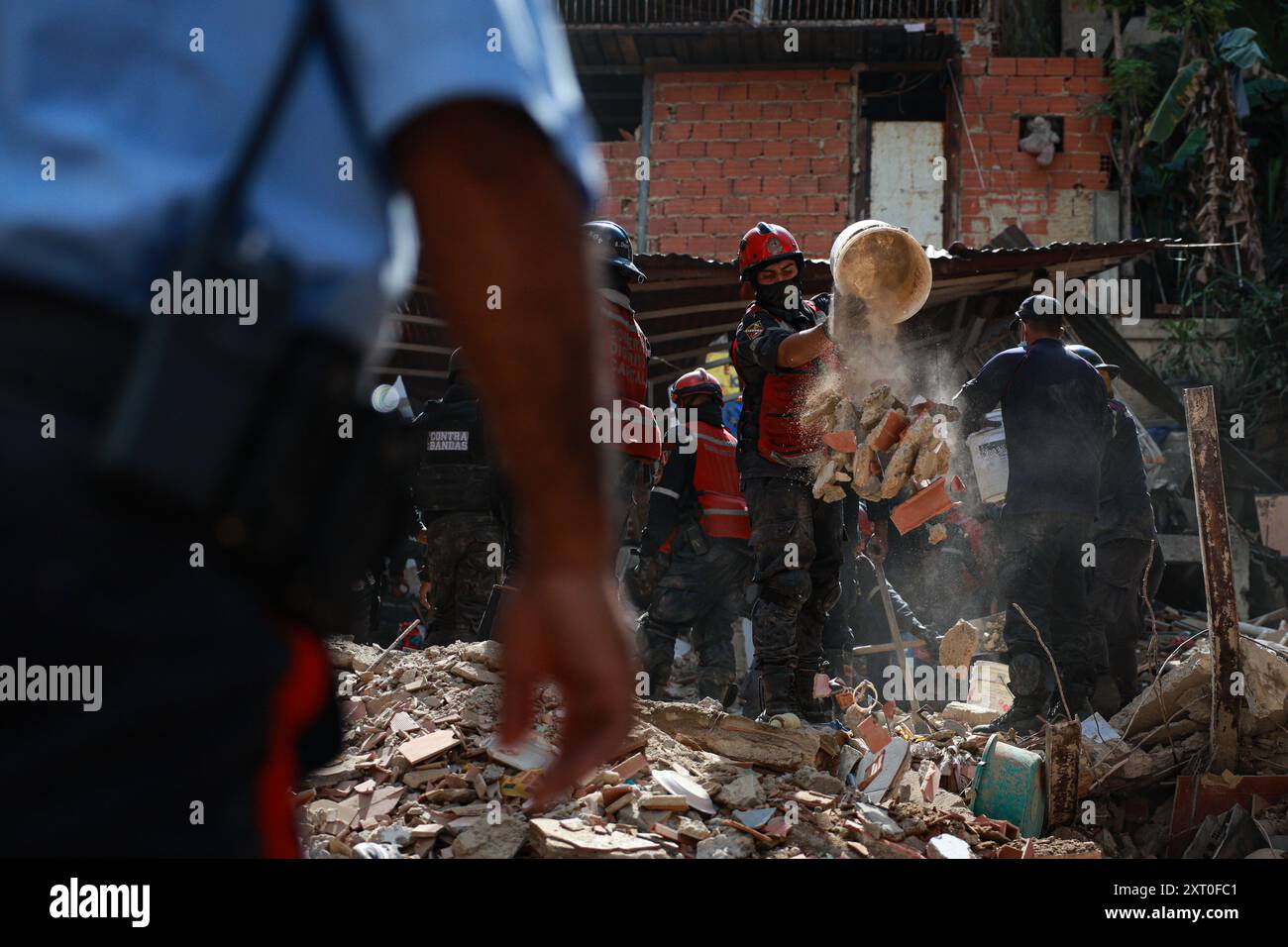 Caracas, Venezuela. 12th Aug, 2024. Firefighters take part in a search ...