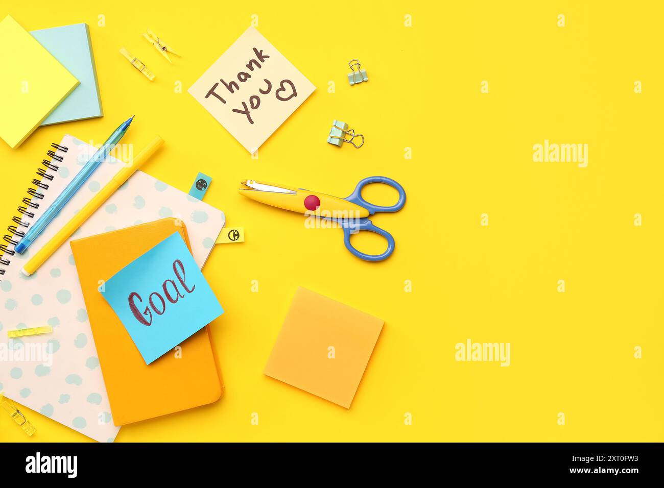 Sticky notes with notebooks and stationery on yellow background Stock ...