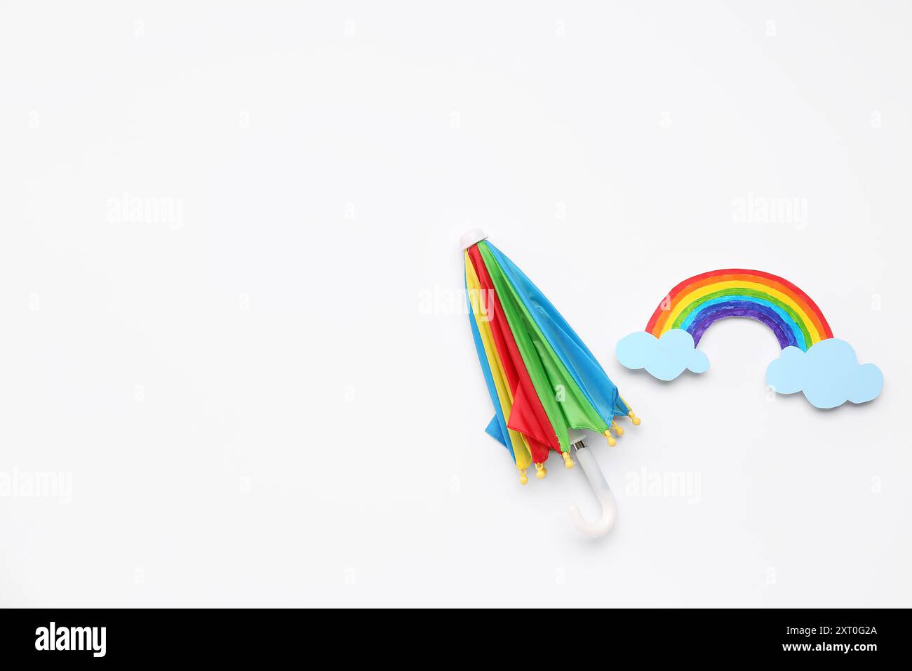 Paper rainbow with umbrella on white background. Weather forecast ...