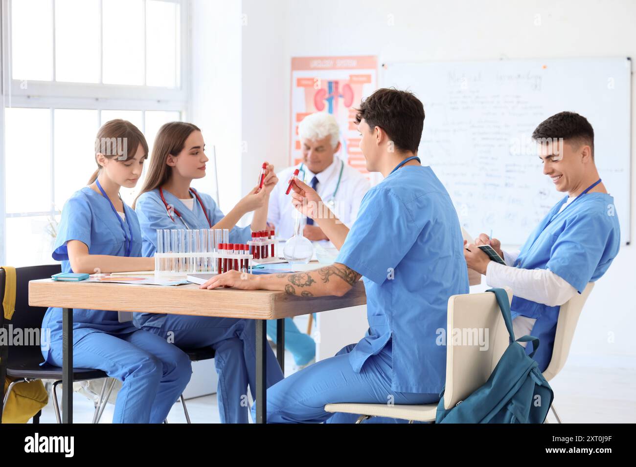 Medical students with blood samples studying at university Stock Photo ...