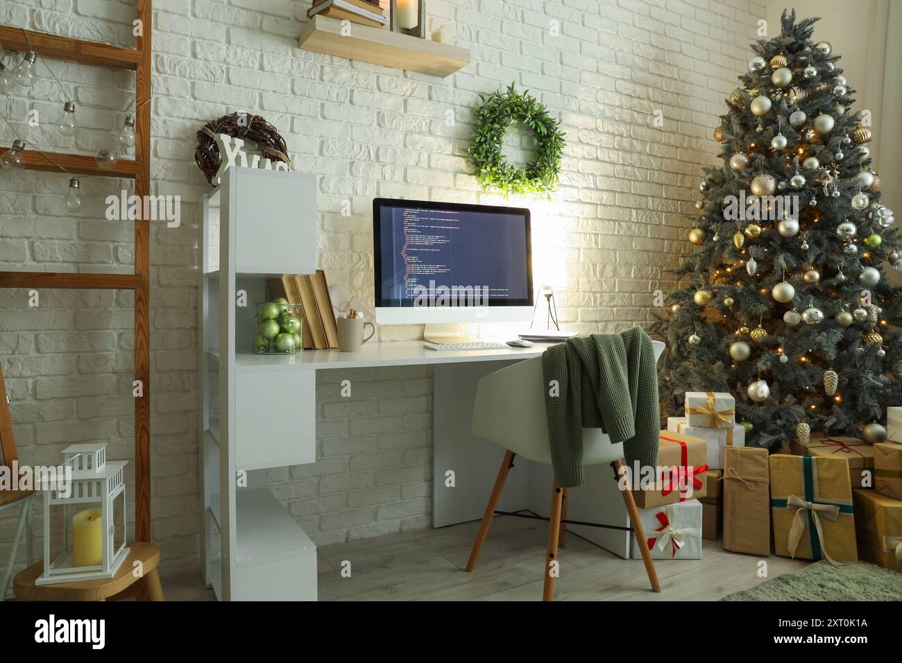 Interior of programmer's office with workplace, Christmas tree and ...