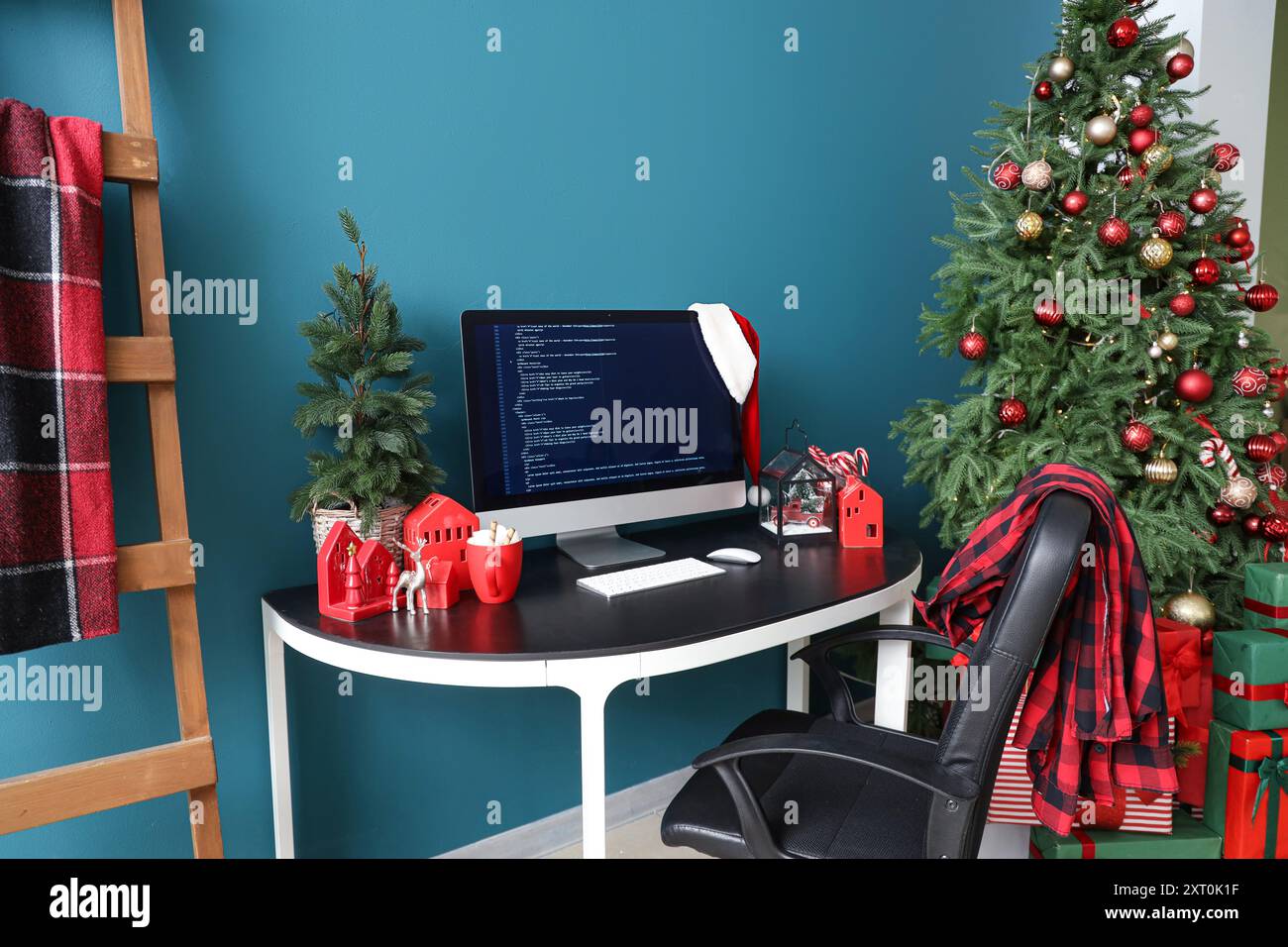 Interior of programmer's office with workplace, Christmas trees and ...