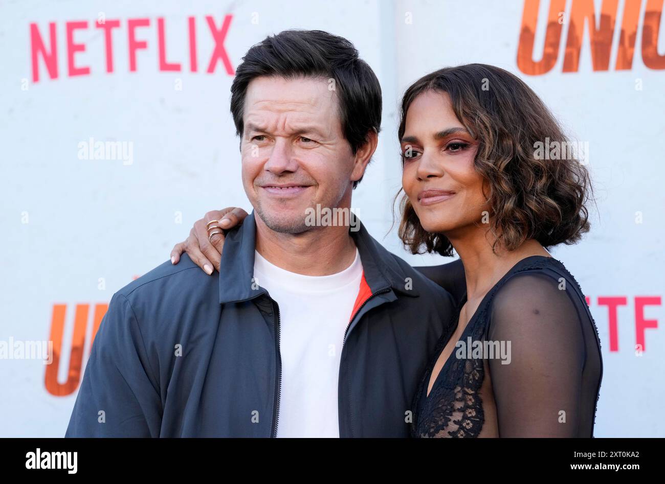 Mark Wahlberg, left, and Halle Berry, cast members in "The Union," pose ...