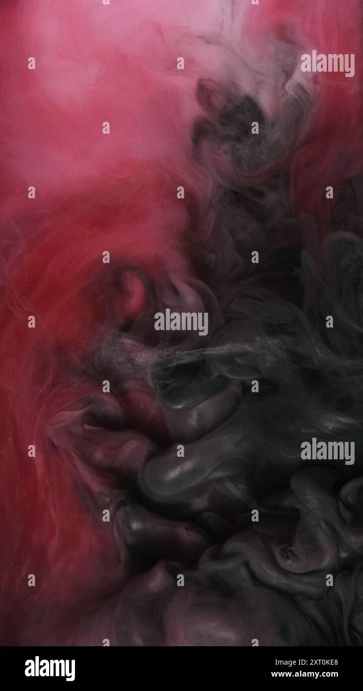 Shimmering paint splash. Smoke cloud. Defocused red pink black color ...