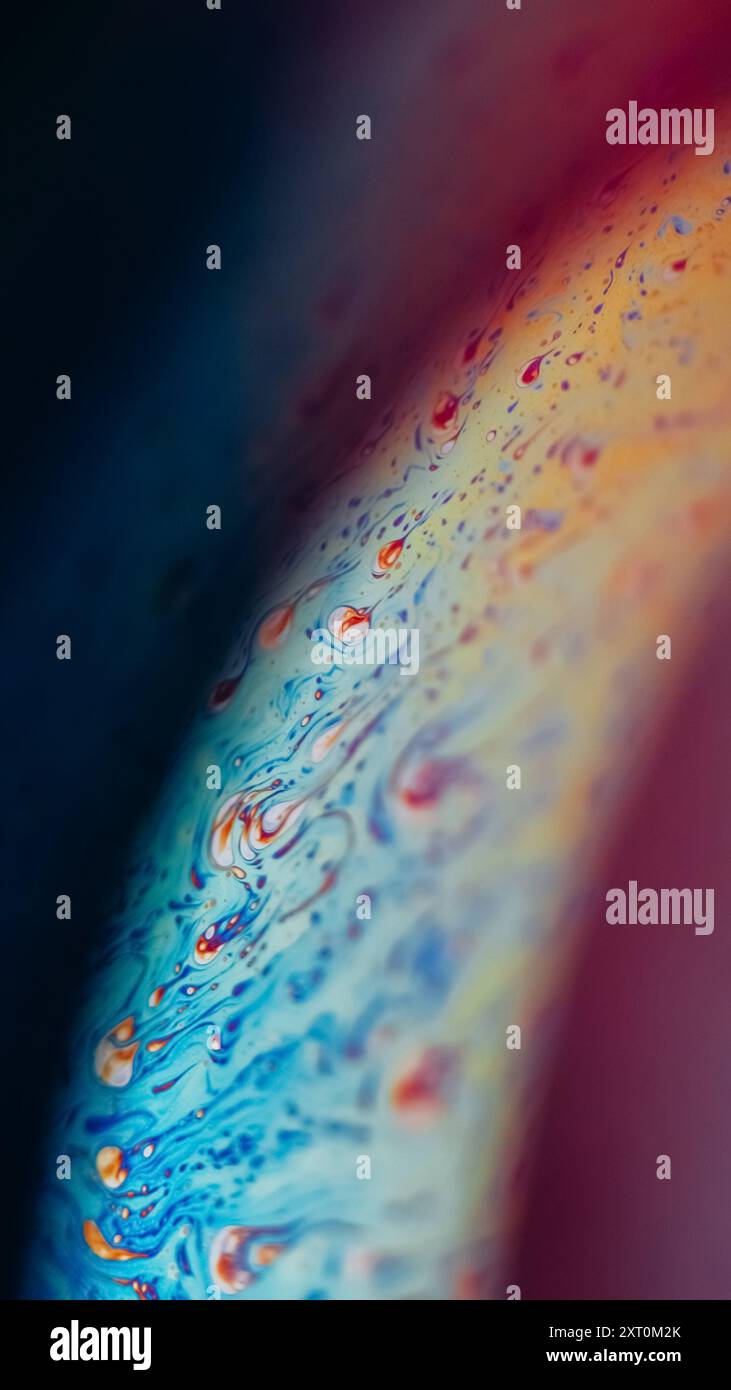 Defocused chemical fluid. Paint curve. Blur yellow blue pink color ...