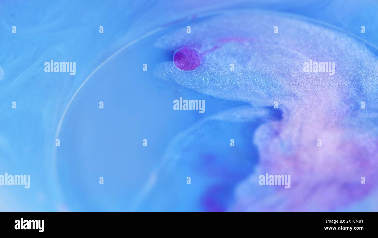 Sparkling paint. Shimmer ink. Glitter space. Defocused blue pink purple ...