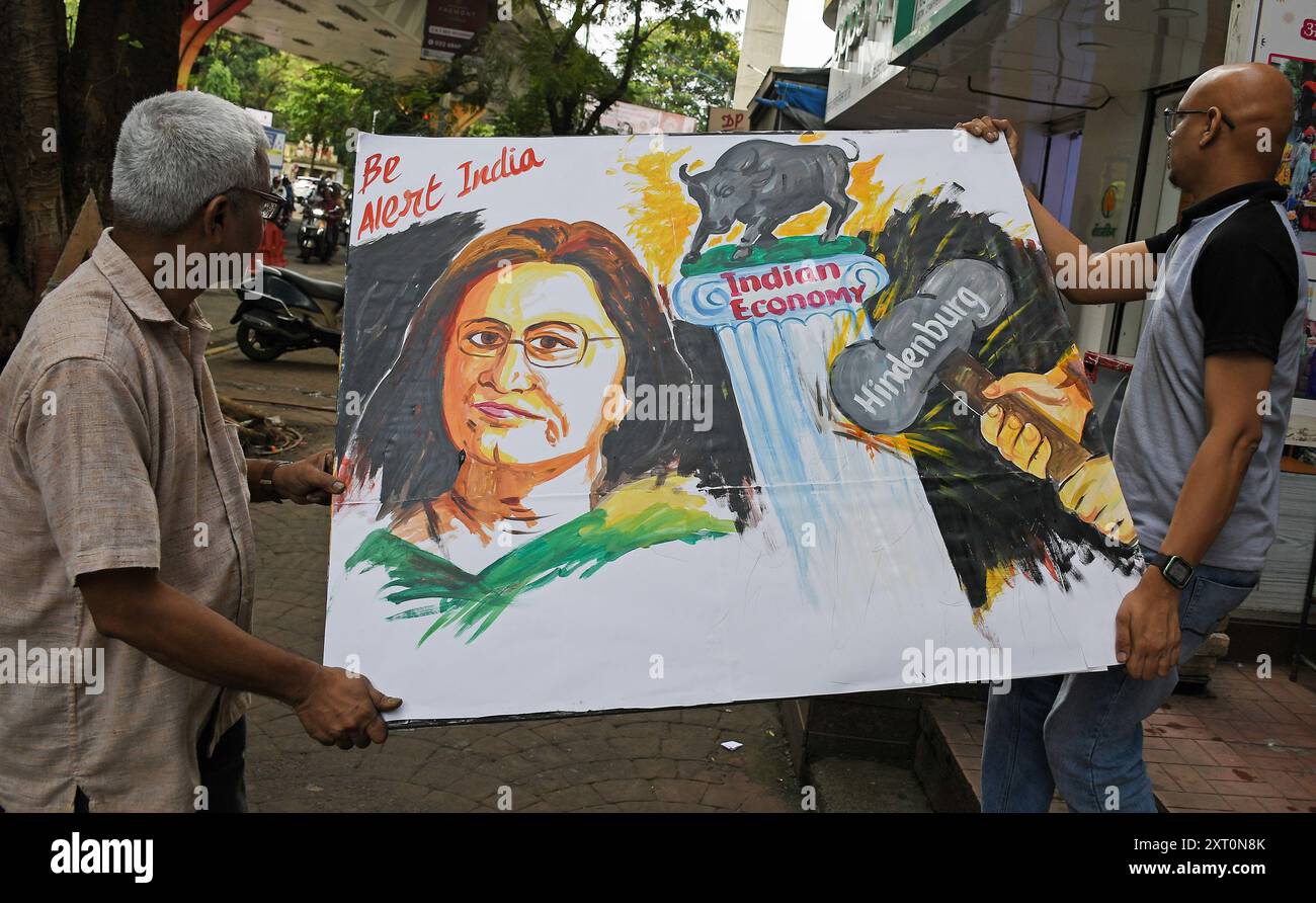 Teachers from Gurukul School of Art carry a painting of Madhabi Puri ...