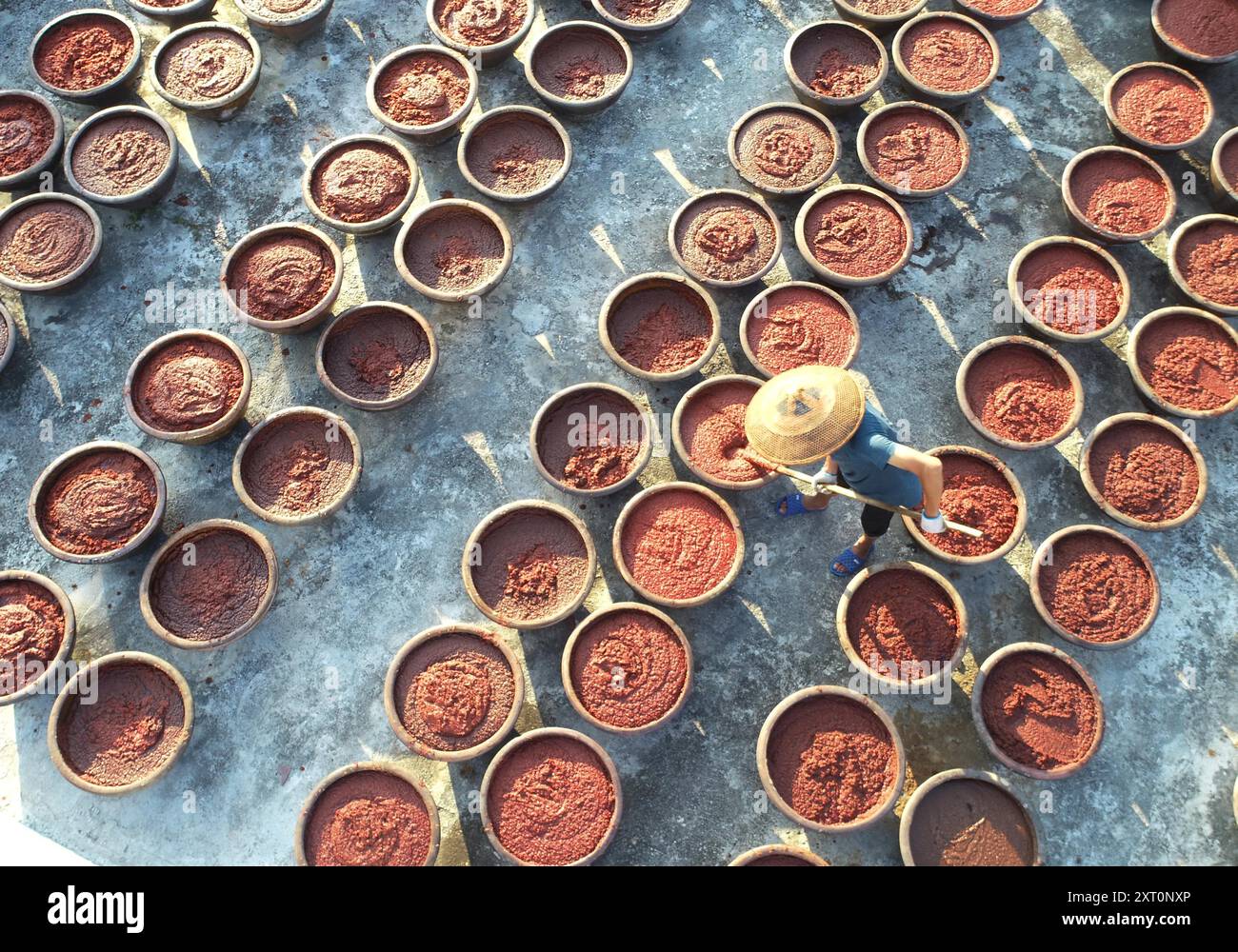 Aerial photo shows people drying hot peppers to make chilli sauce in ...