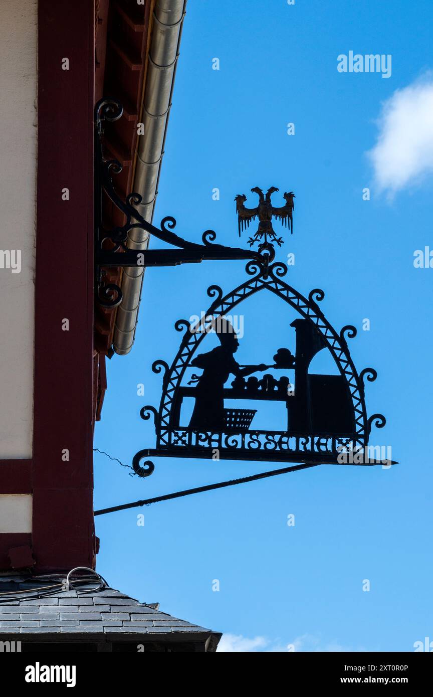 A traditional metal sign of a cake-baker in Normandy Stock Photo - Alamy