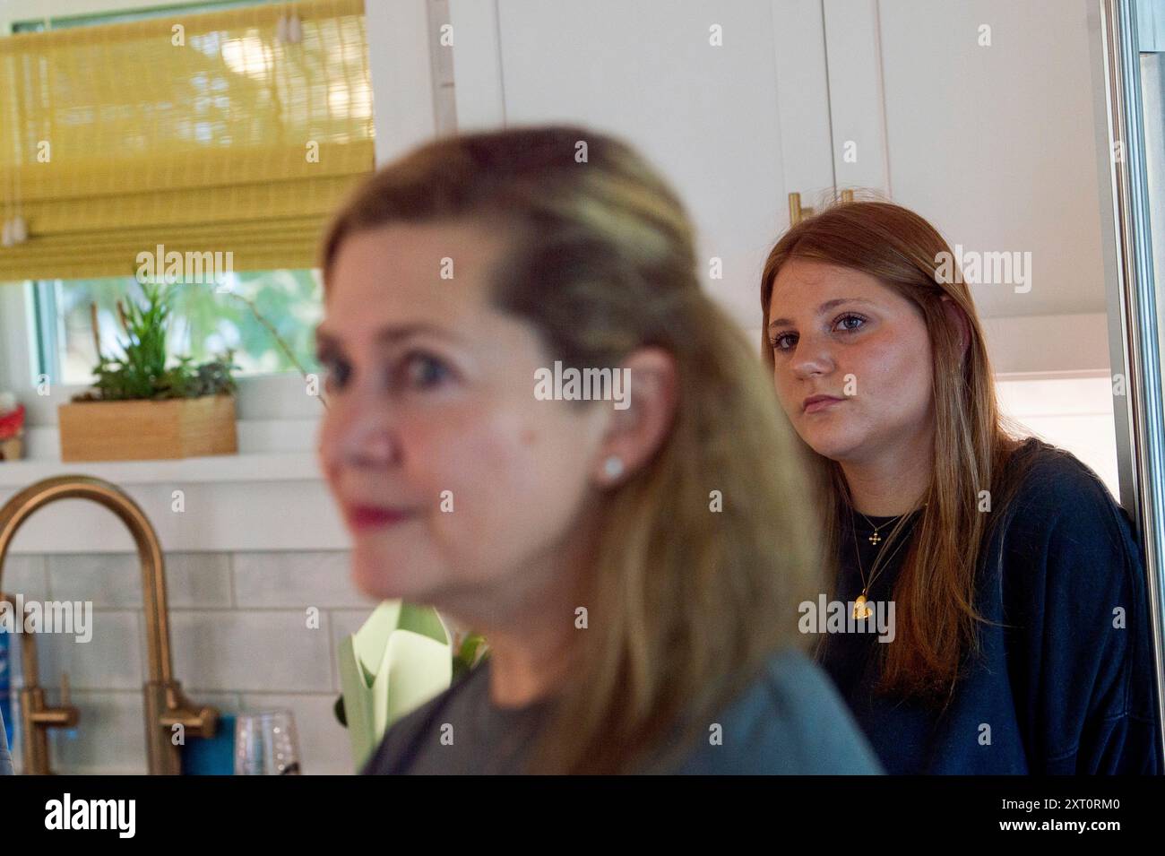 Alexia Collart, left, and her daughter Gwyneth, right, talk about her ...