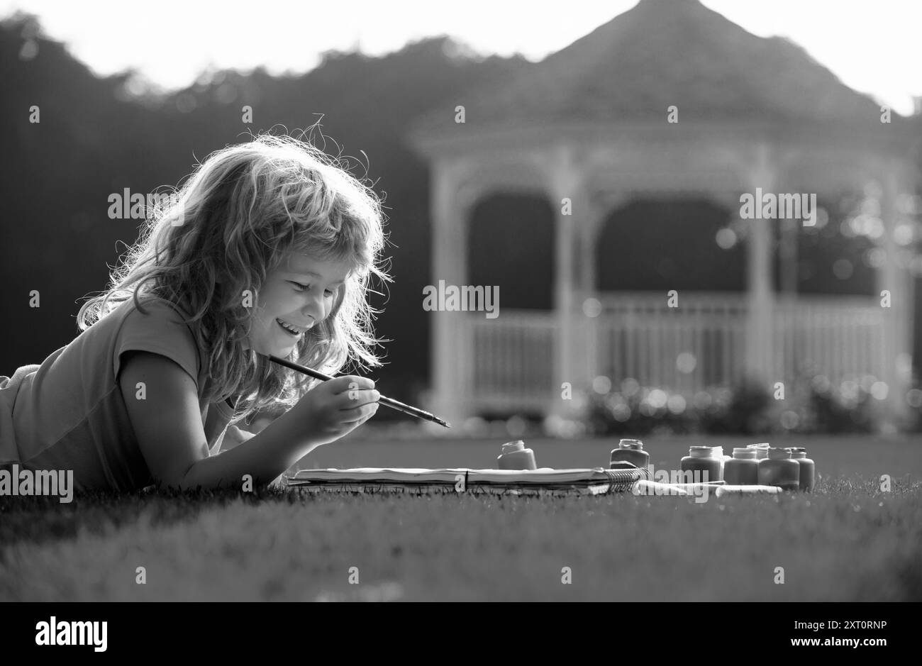 Children draw paint pictures outside, childrens creativity. Schooler ...