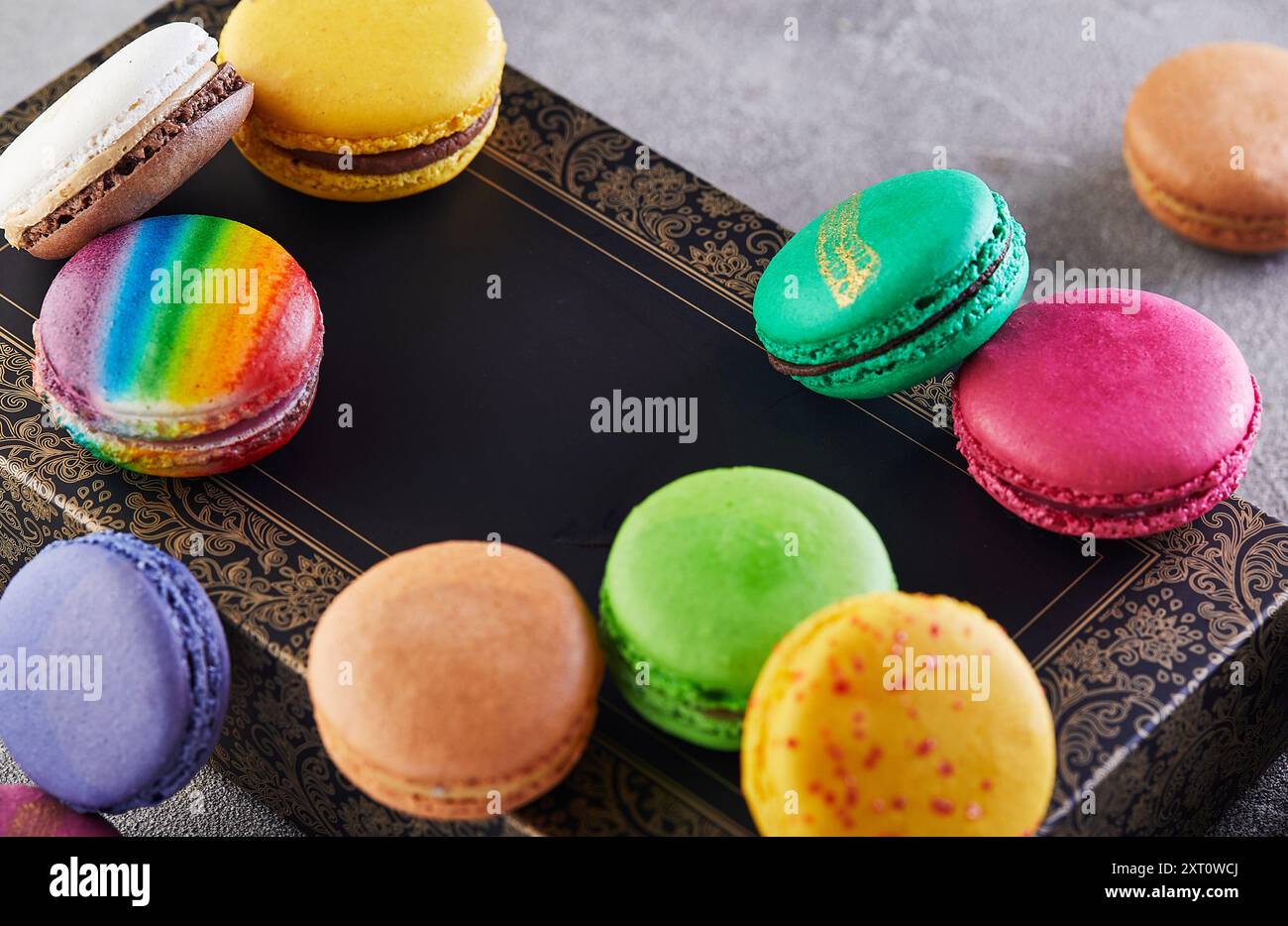 Variety of colorful macarons placed on an elegant decorative box ...