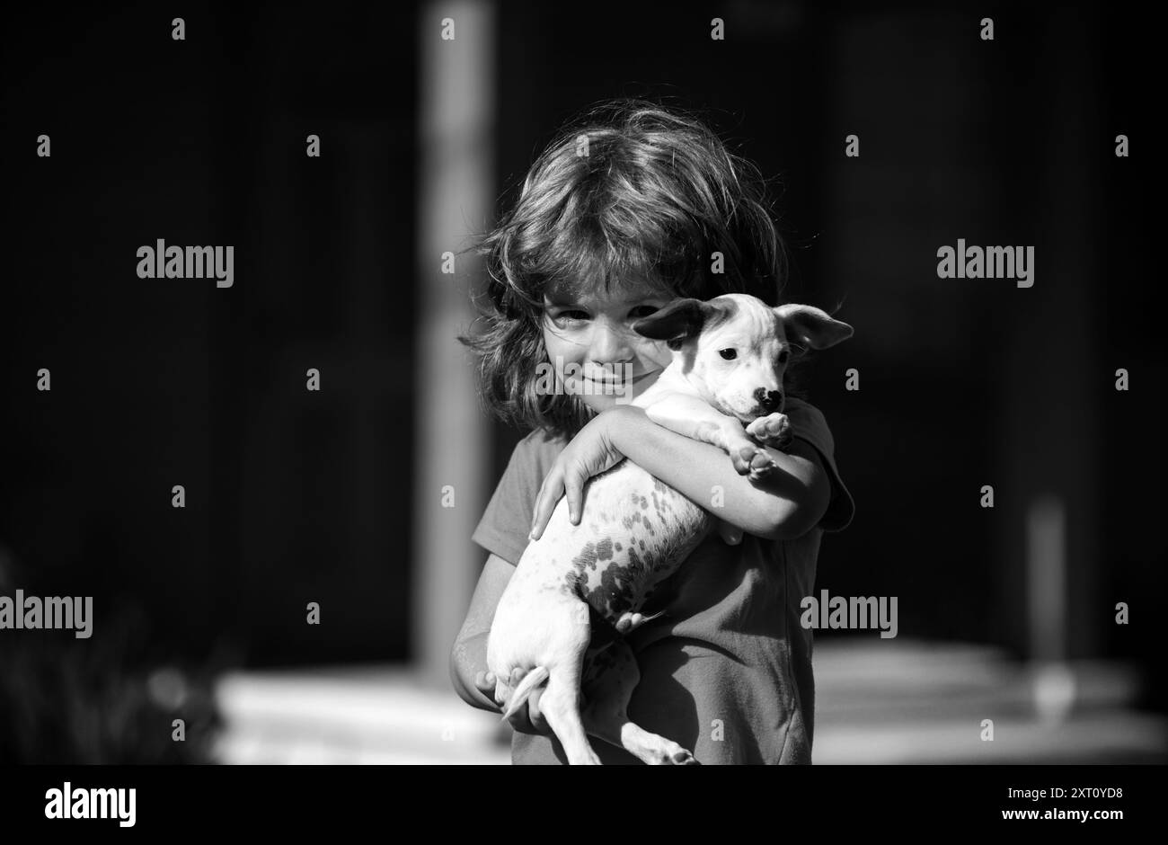Child hug animal Black and White Stock Photos & Images - Alamy