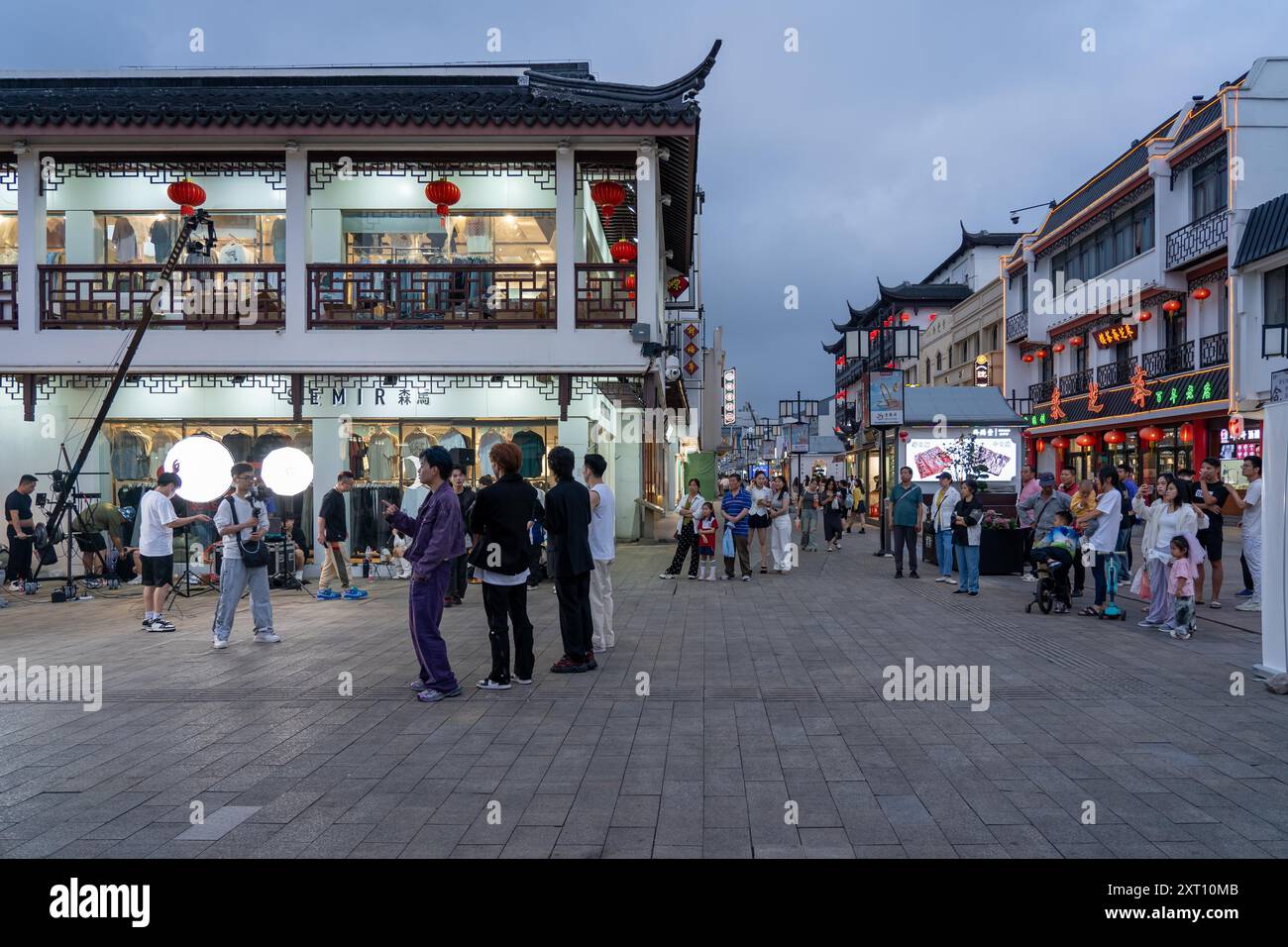 Suzhou, China - June 11, 2024 : A group of people gather on a ...