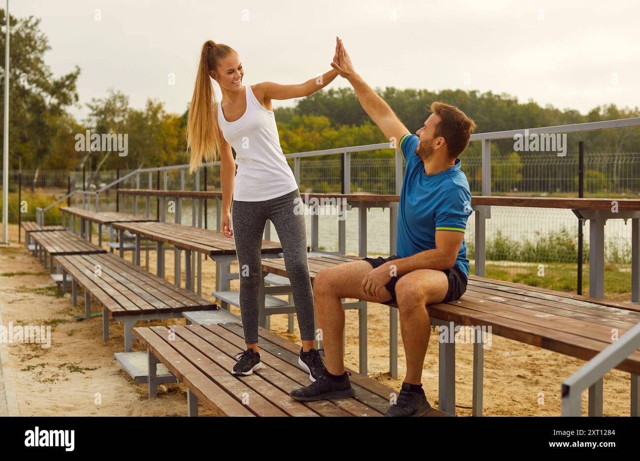 Family Couple Giving High Five During Outdoor Workout Stock Photo - Alamy