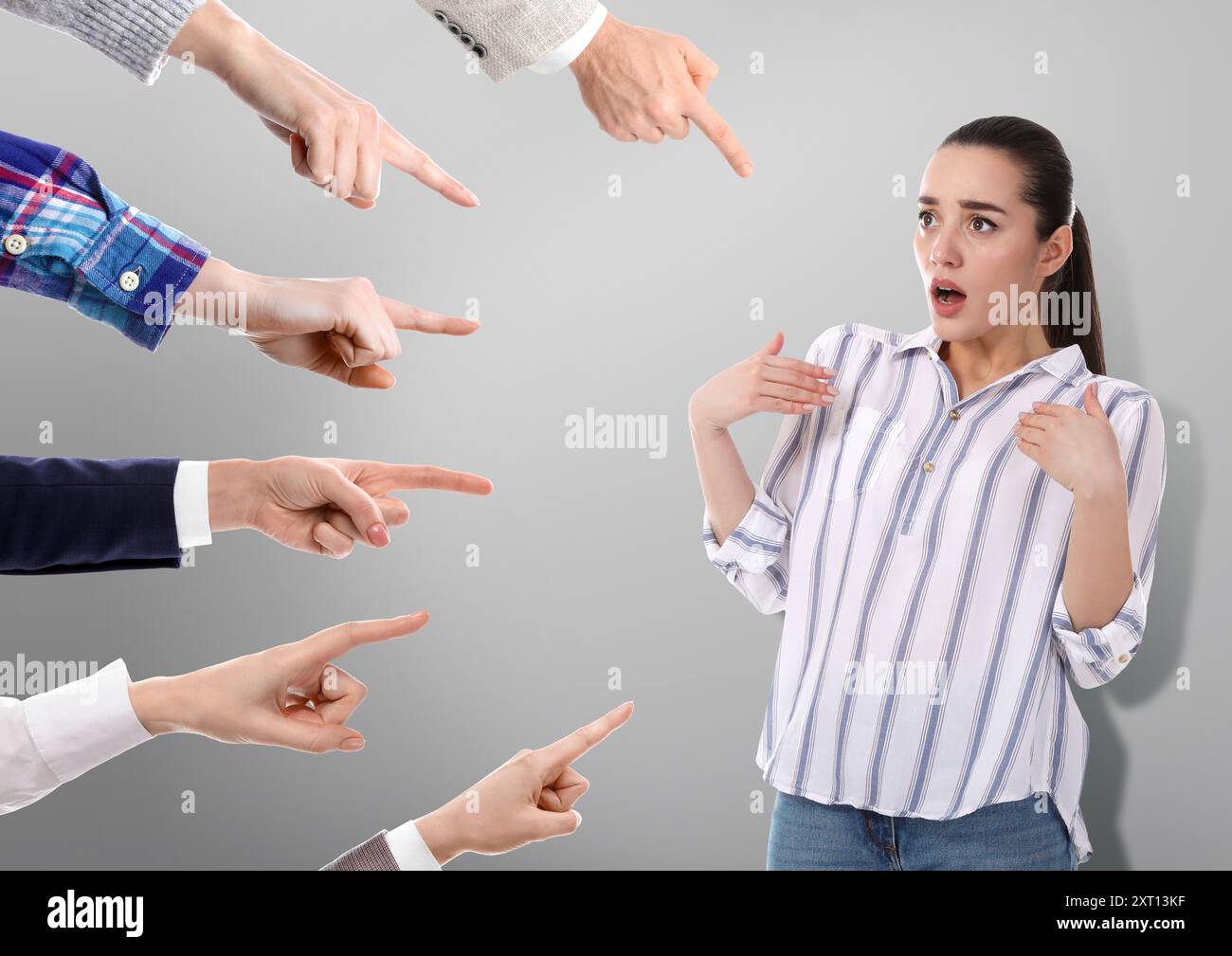 People pointing at confused woman on grey background. Failure ...