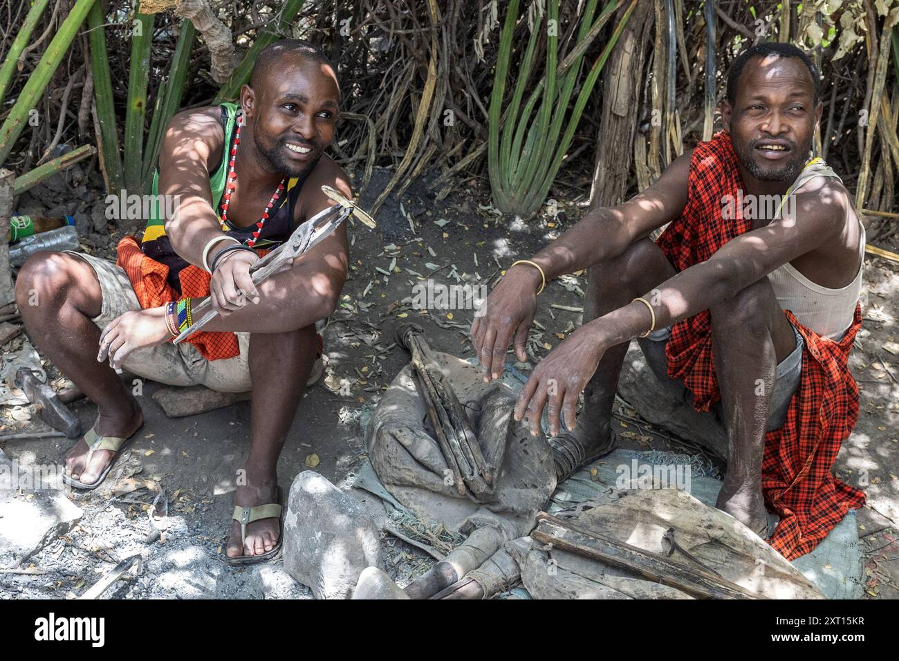Blacksmitthing: melting pieces of scrap brass using bellows made from ...
