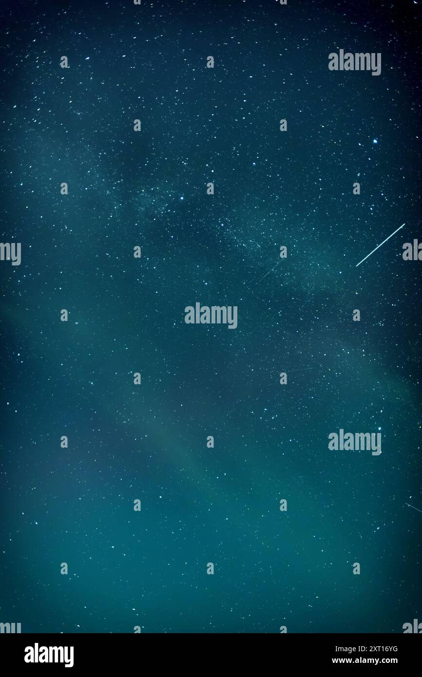 A beautiful night sky with a shooting star streaking across the dark ...