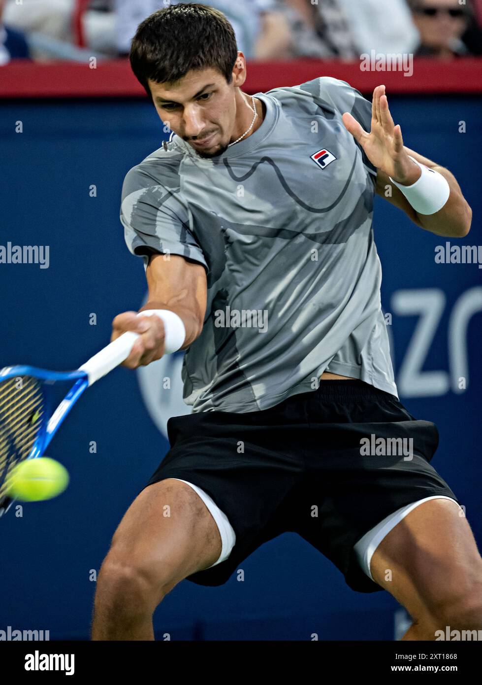 Montreal, Canada. 12th Aug, 2024. Alexei Popyrin of Australia returns ...