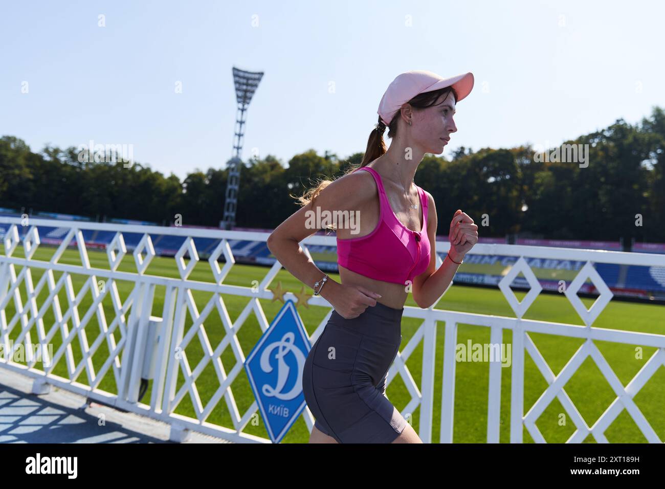 Skinny Ukrainian girl running a distance at stadium. Kyiv - 10 August ...
