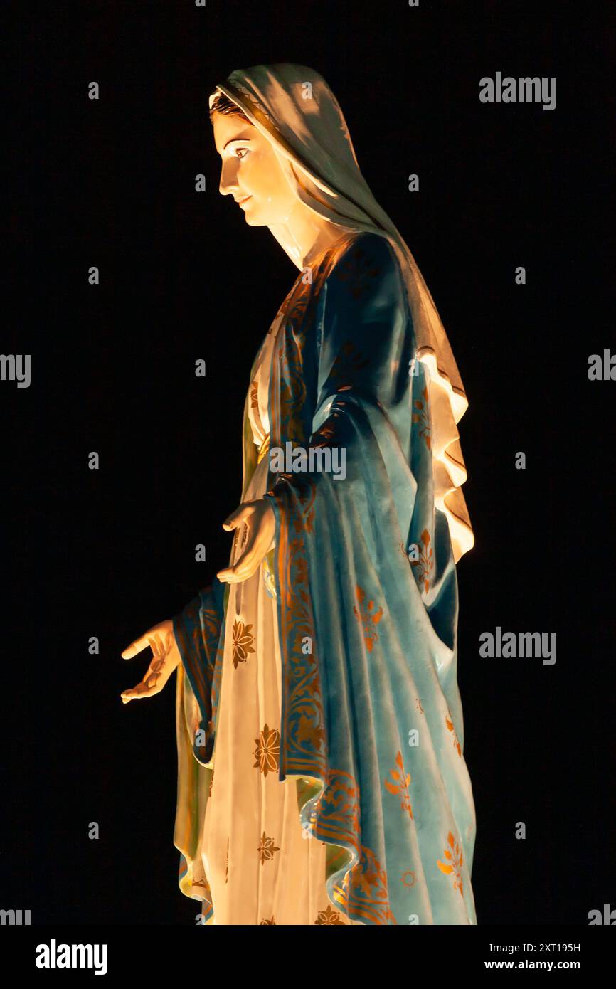 Side view of the Virgin Mary statue at night. Cathedral of the ...