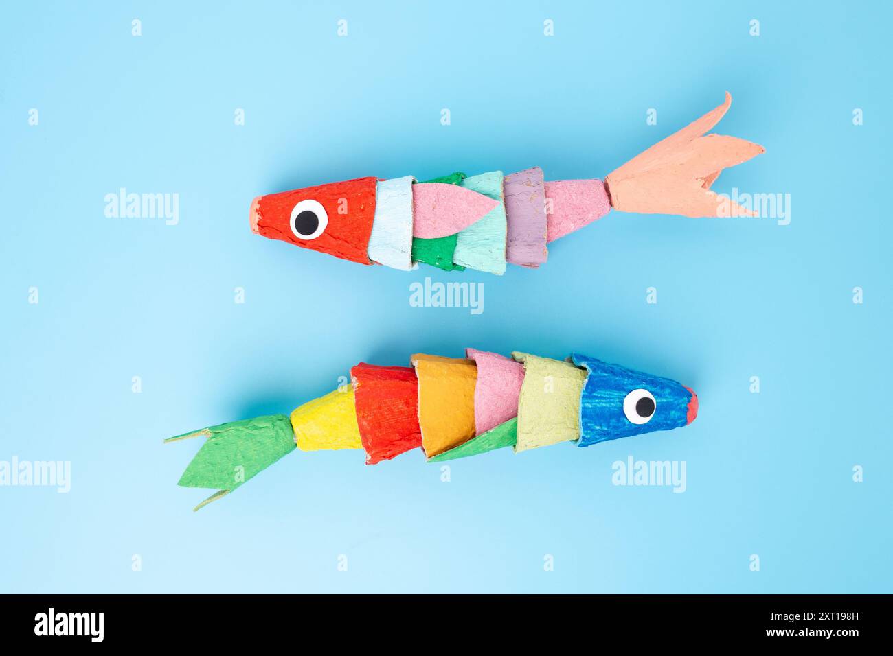 Colorful fish made of recycled paper of empty egg box, arranged on ...