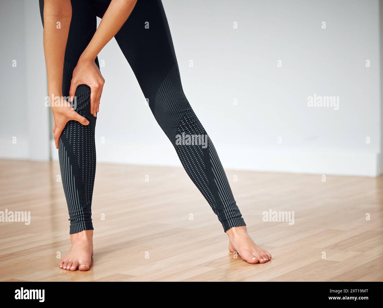 Injury, knee and hands on leg in class, accident and inflammation for ...