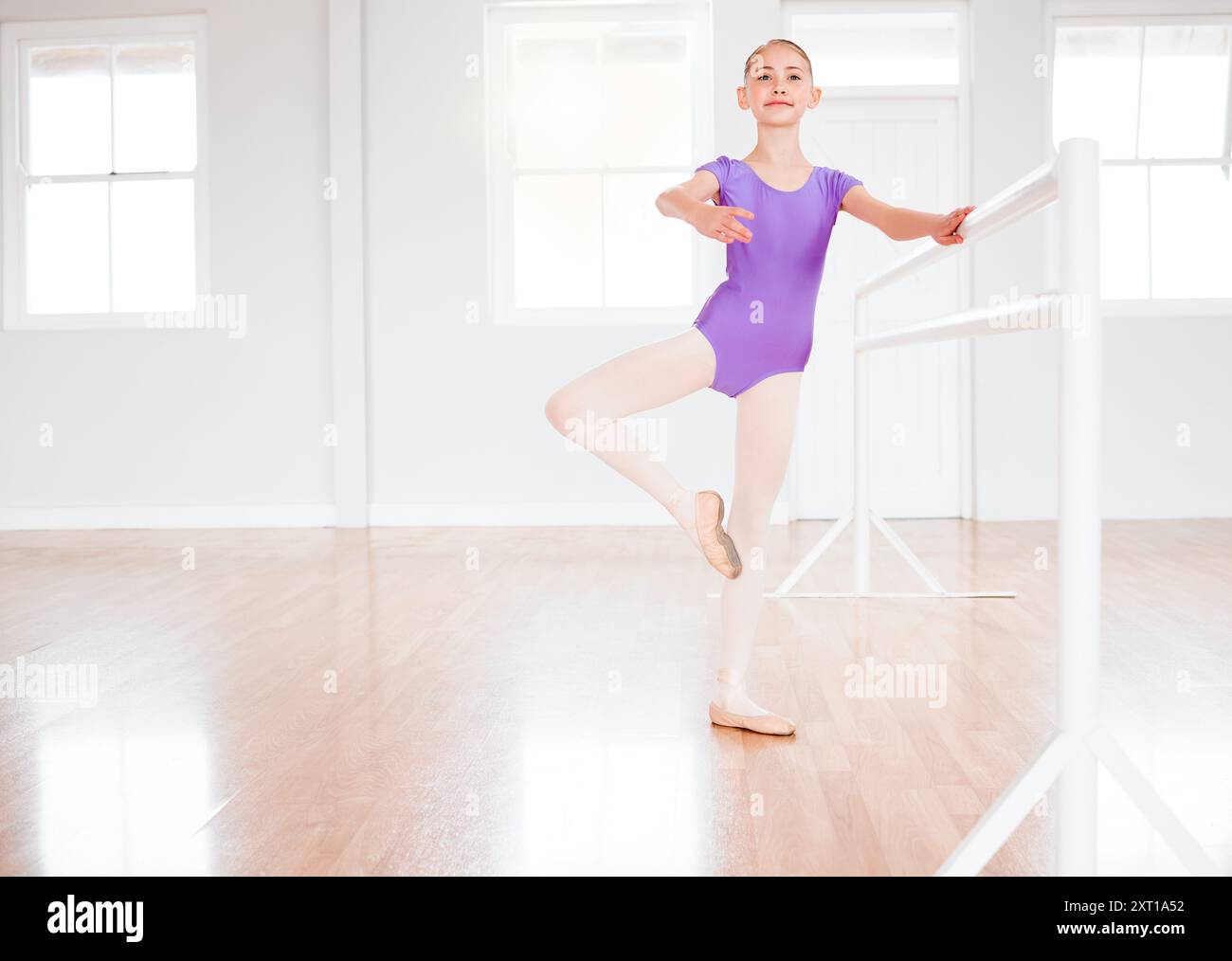 Ballet, student and practice with bar in class for dancing routine, leg ...