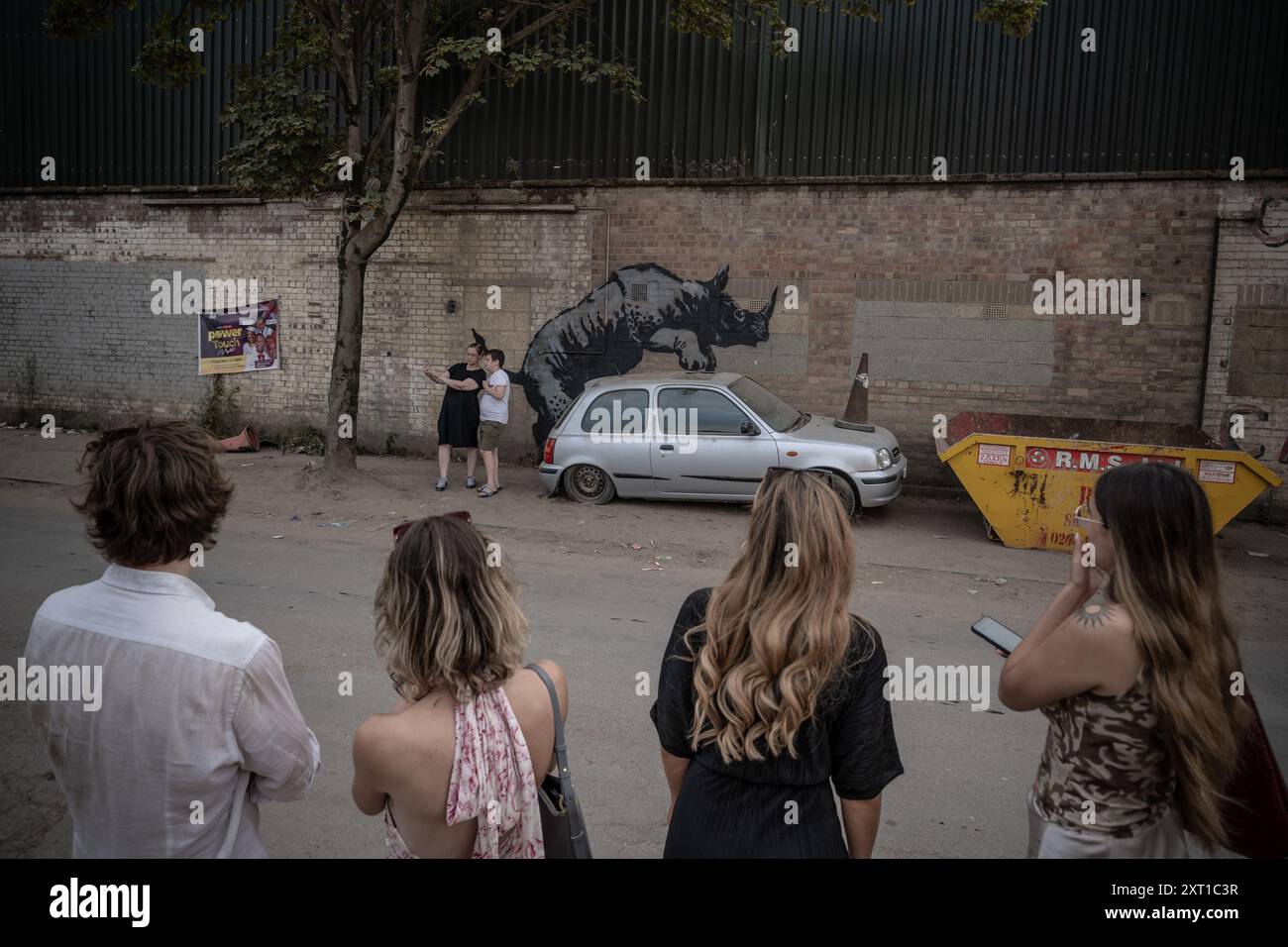 London, UK. 12th August 2024. Banksy Rhino art mural in London. Locals ...
