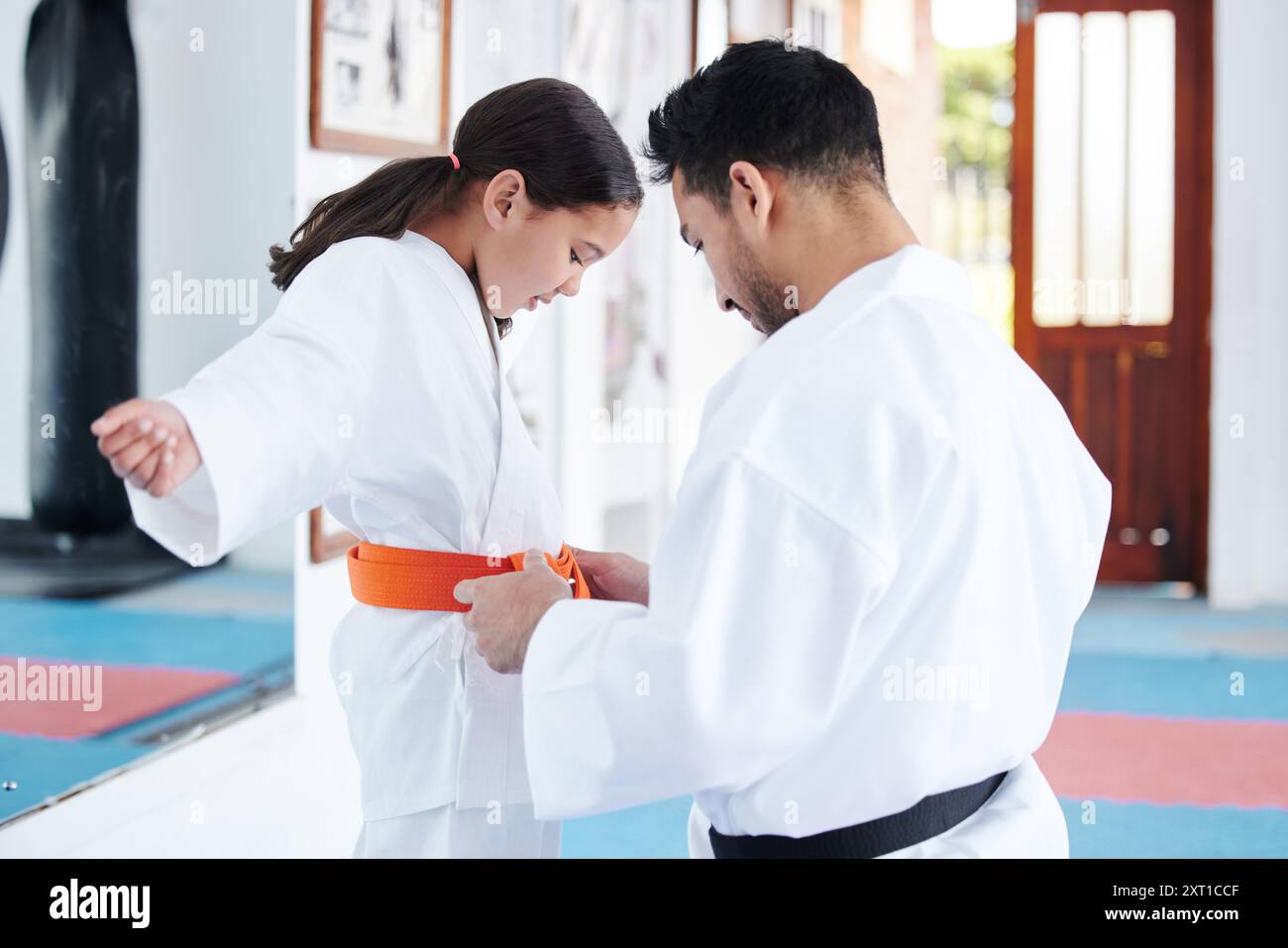 Karate, martial arts and child with teacher in dojo for learning aikido ...