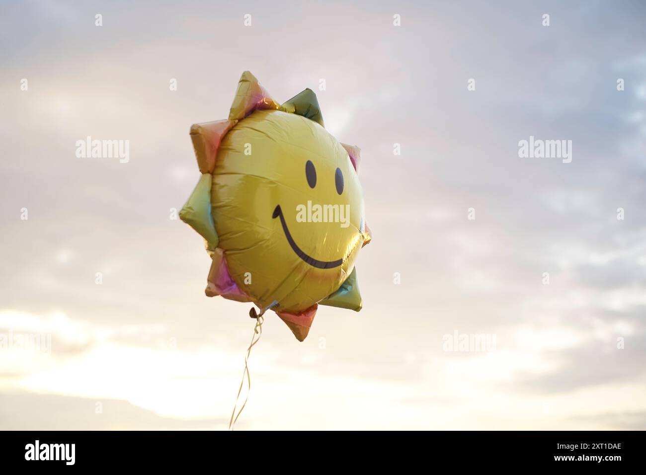 Helium ballon smiley face hi-res stock photography and images - Alamy