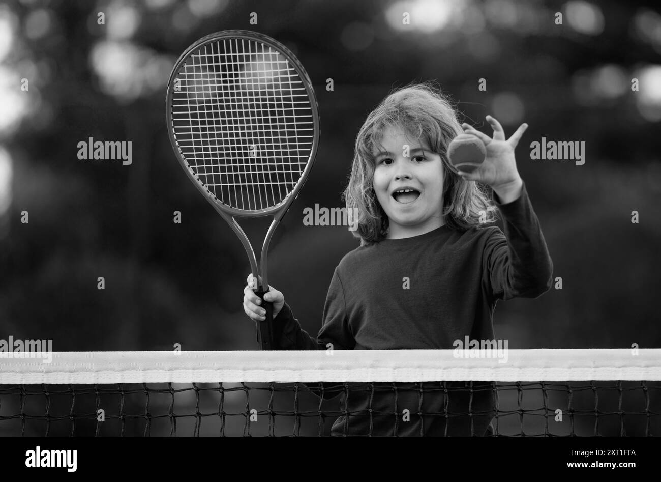 Child playing tennis on court. Child playing tennis in sport club ...