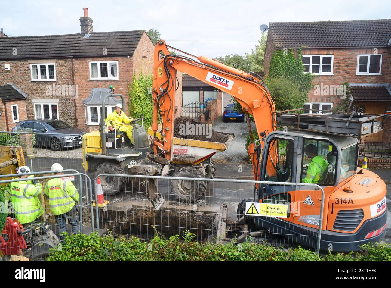 engineers installing new pipe line beneath high street to stop flooding ...