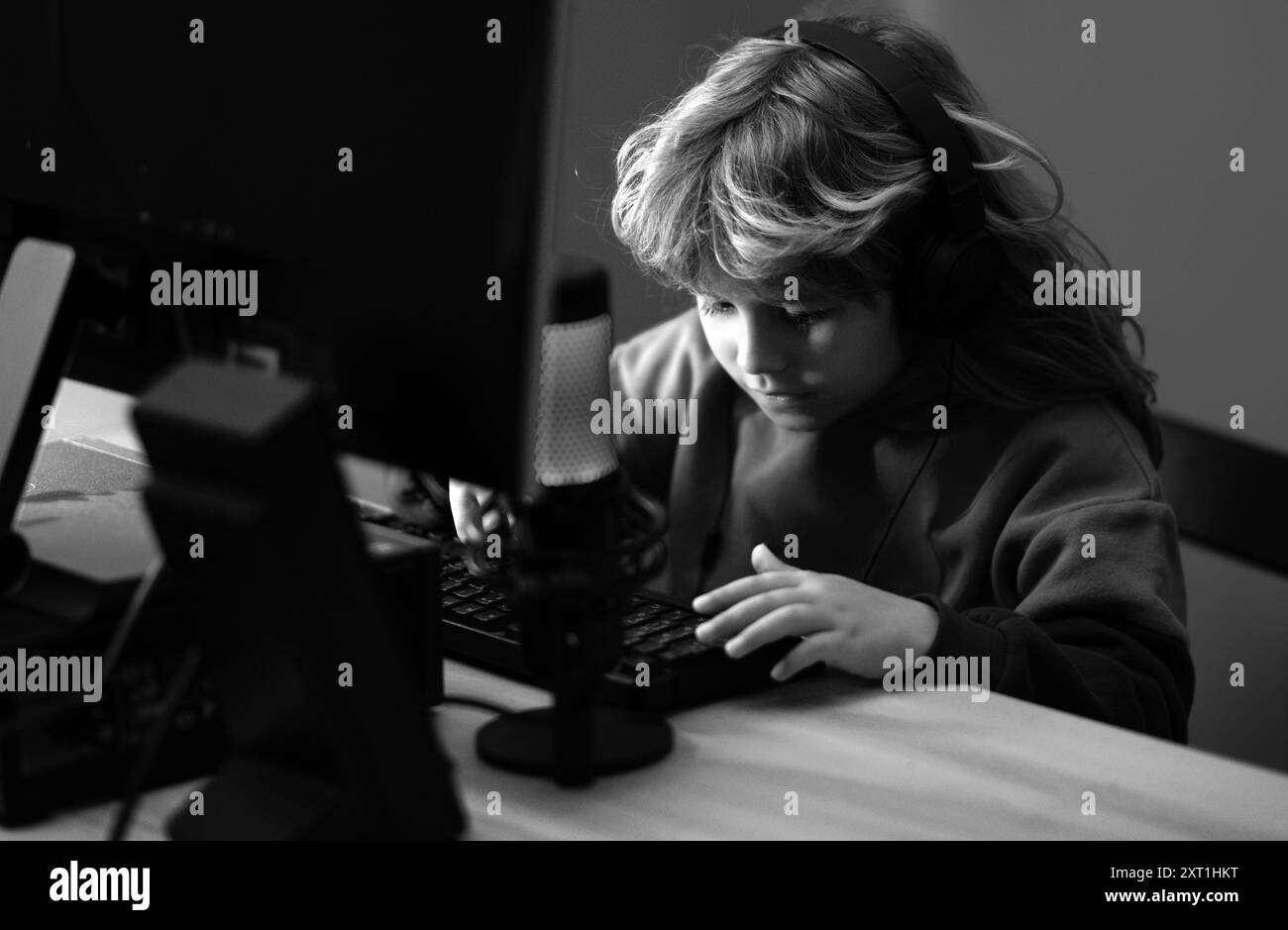 Little hacker, young programmer. Child with pc computer at night ...