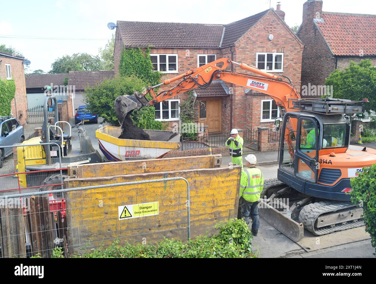 engineers installing new pipe line beneath high street to stop flooding ...