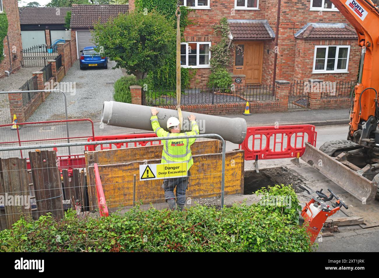 engineers installing new pipe line beneath high street to stop flooding ...