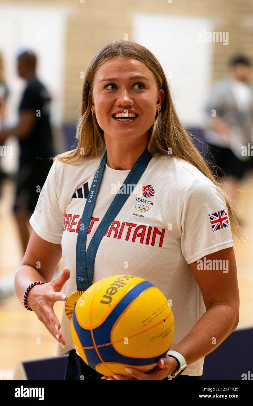 Lola Anderson plays basketball with children during the photocall at ...