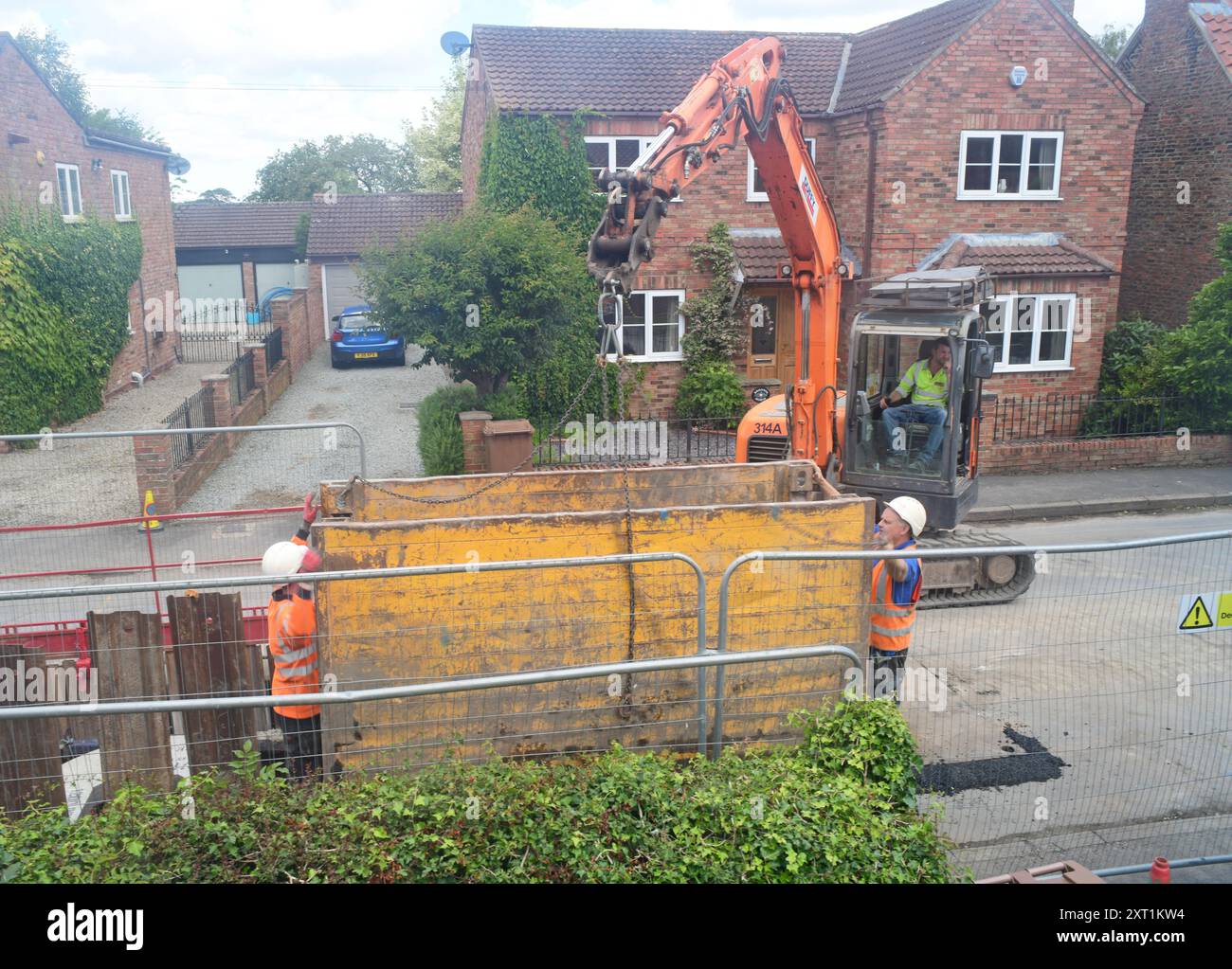 engineers installing new pipe line beneath high street to stop flooding ...