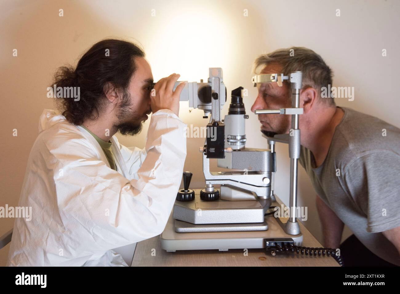 eye examination at the ophthalmologist, checking the eyesight with a ...