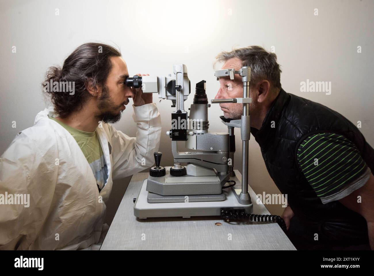 eye examination at the ophthalmologist, checking the eyesight with a ...