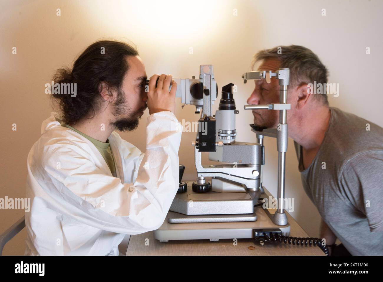 eye examination at the ophthalmologist, checking the eyesight with a ...