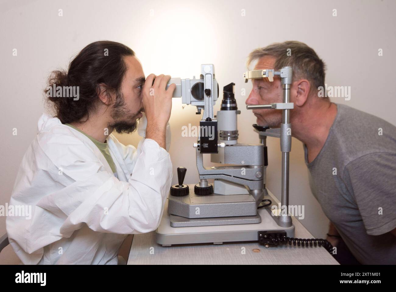 eye examination at the ophthalmologist, checking the eyesight with a ...
