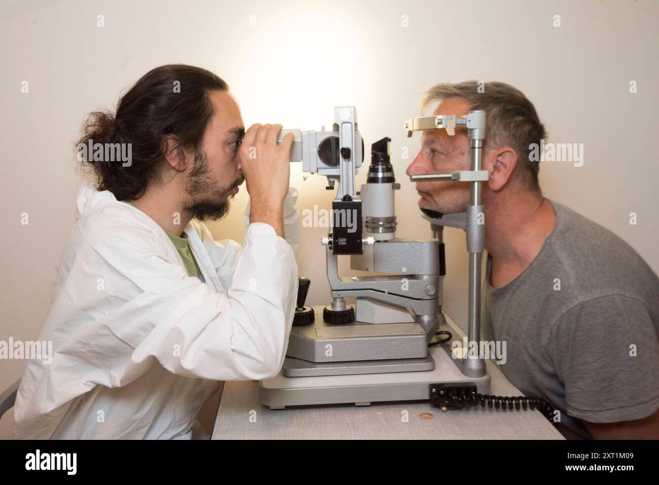 eye examination at the ophthalmologist, checking the eyesight with a ...