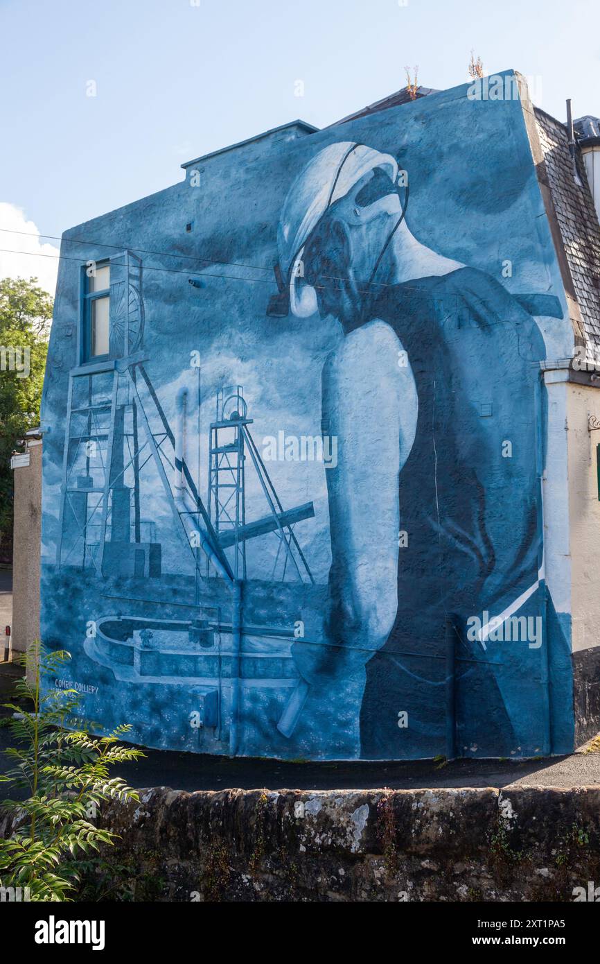 A massive mural on the side of the village pub in Comrie Fife. The ...