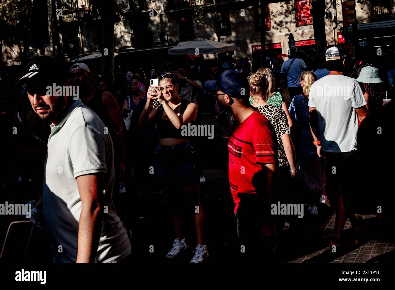 As summer high temperatures continue to rise visitors walk down La ...