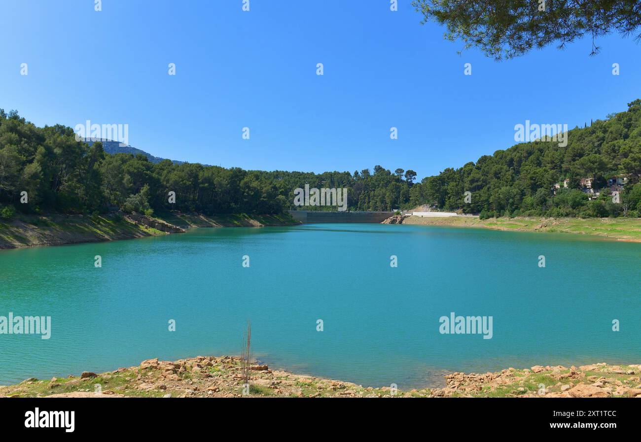 Reservoir lake of the Revest les Eaux dam with the Sarasine tower at ...